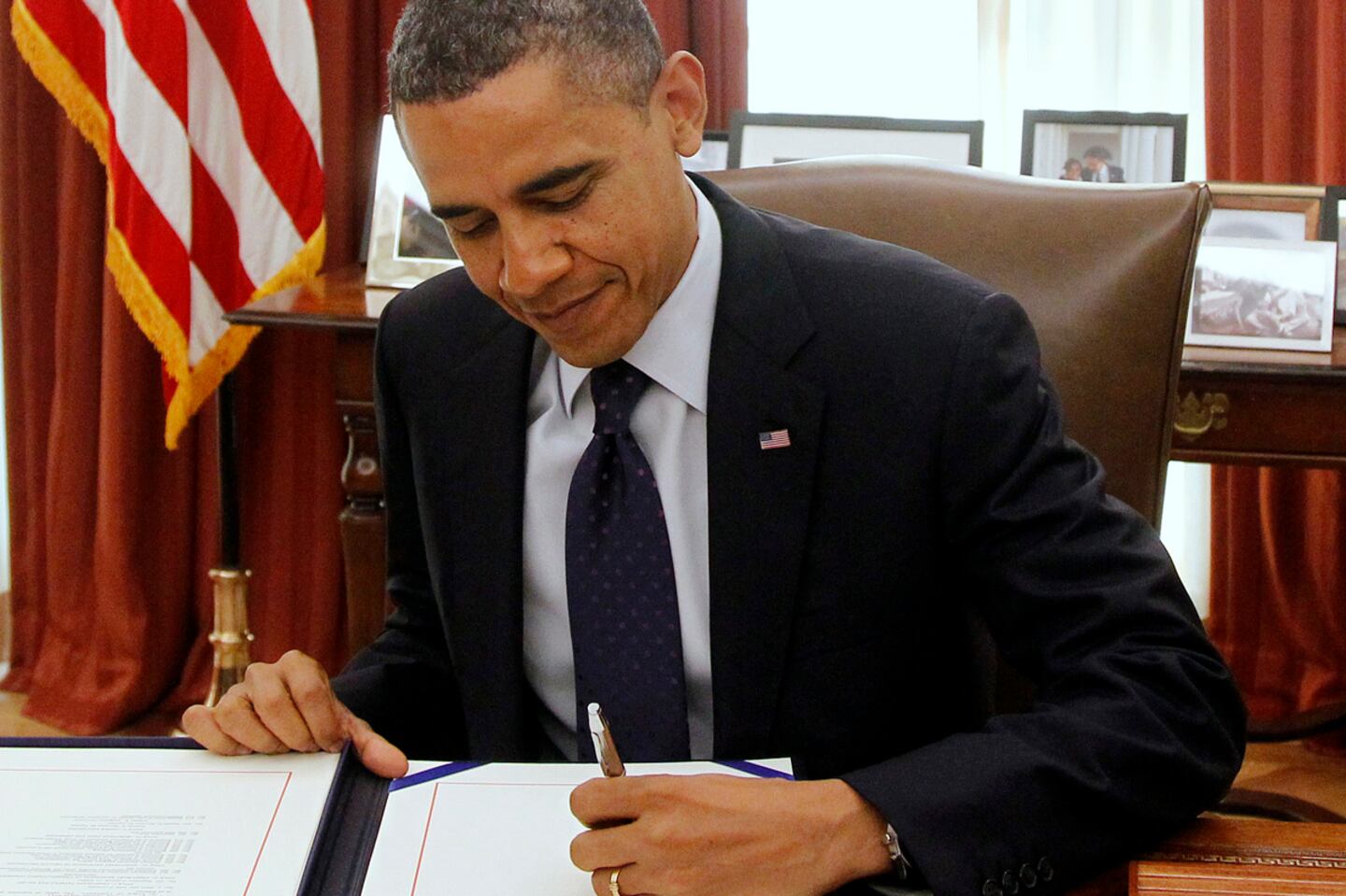 Obama Embraces Signing Statements After Knocking Bush for Using Them