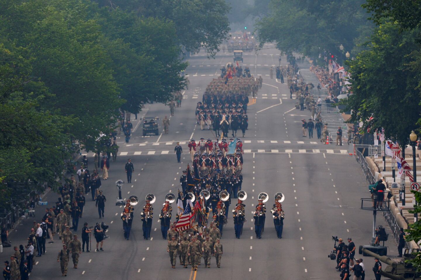 Rain Forces Donald Trump to Rush 79th Birthday Parade Past Empty Bleachers