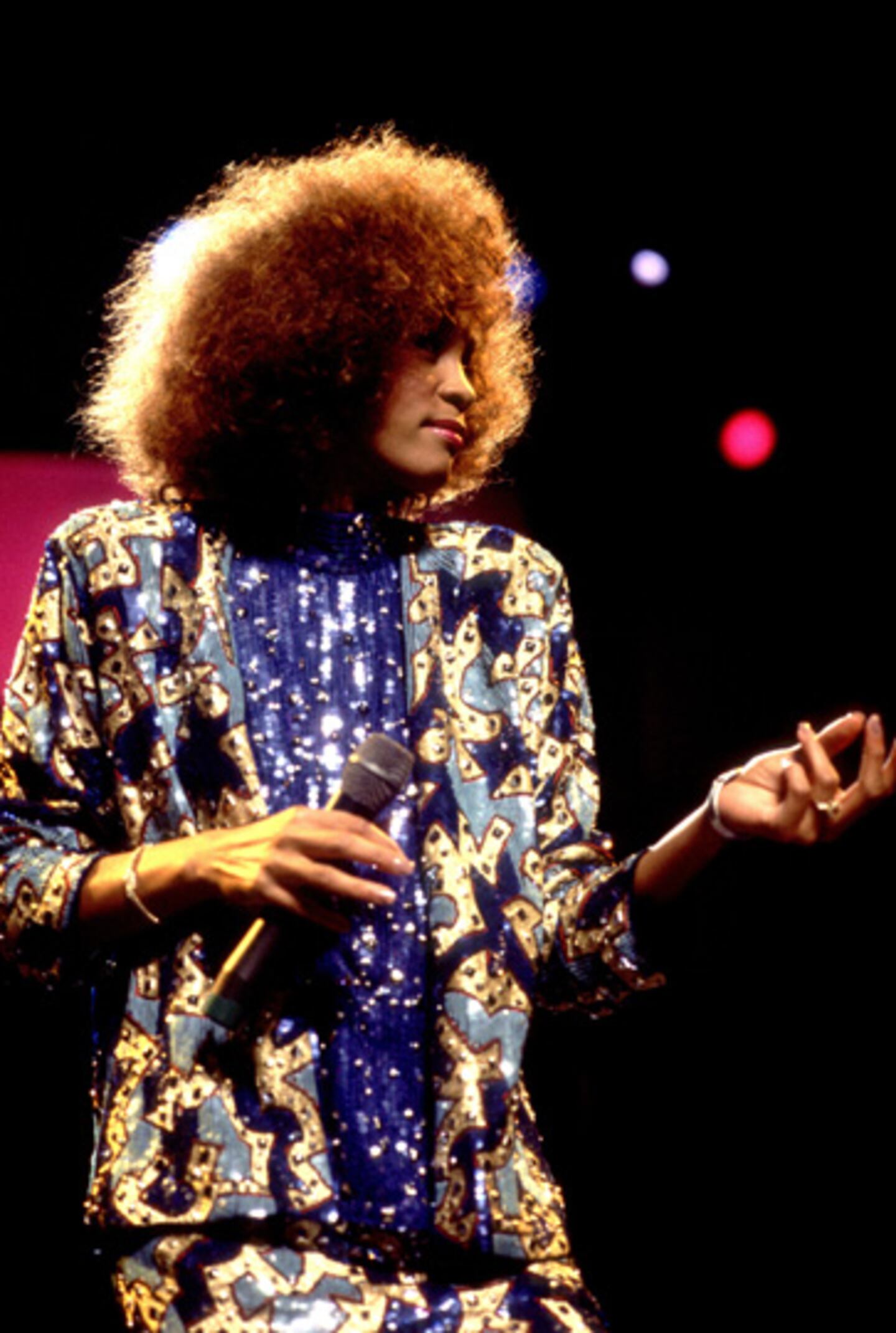 Whitney Houston’s Signature Style Looks Over the Years (PHOTOS)